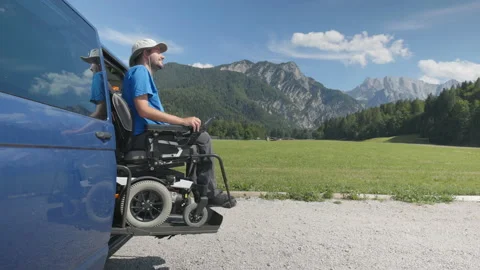 Man getting out the van by using a wheel... | Stock Video | Pond5