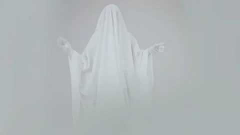 man in ghost costume with white sheet da... | Stock Video | Pond5