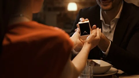 Man giving an engagement ring to his gir... | Stock Video | Pond5