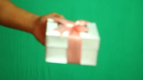 Man giving gift box to someone with gre... | Stock Video | Pond5