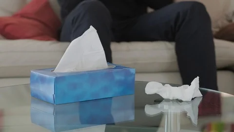 A man Grabs tissue in a Tissue box - Cl... | Stock Video | Pond5