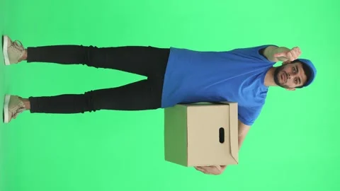 A man on a green background with box. Sh... | Stock Video | Pond5