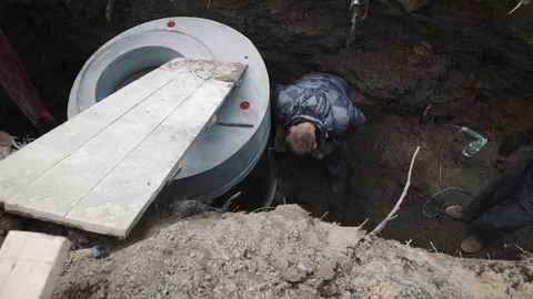Man hammering metal pin in to concrete c... | Stock Video | Pond5