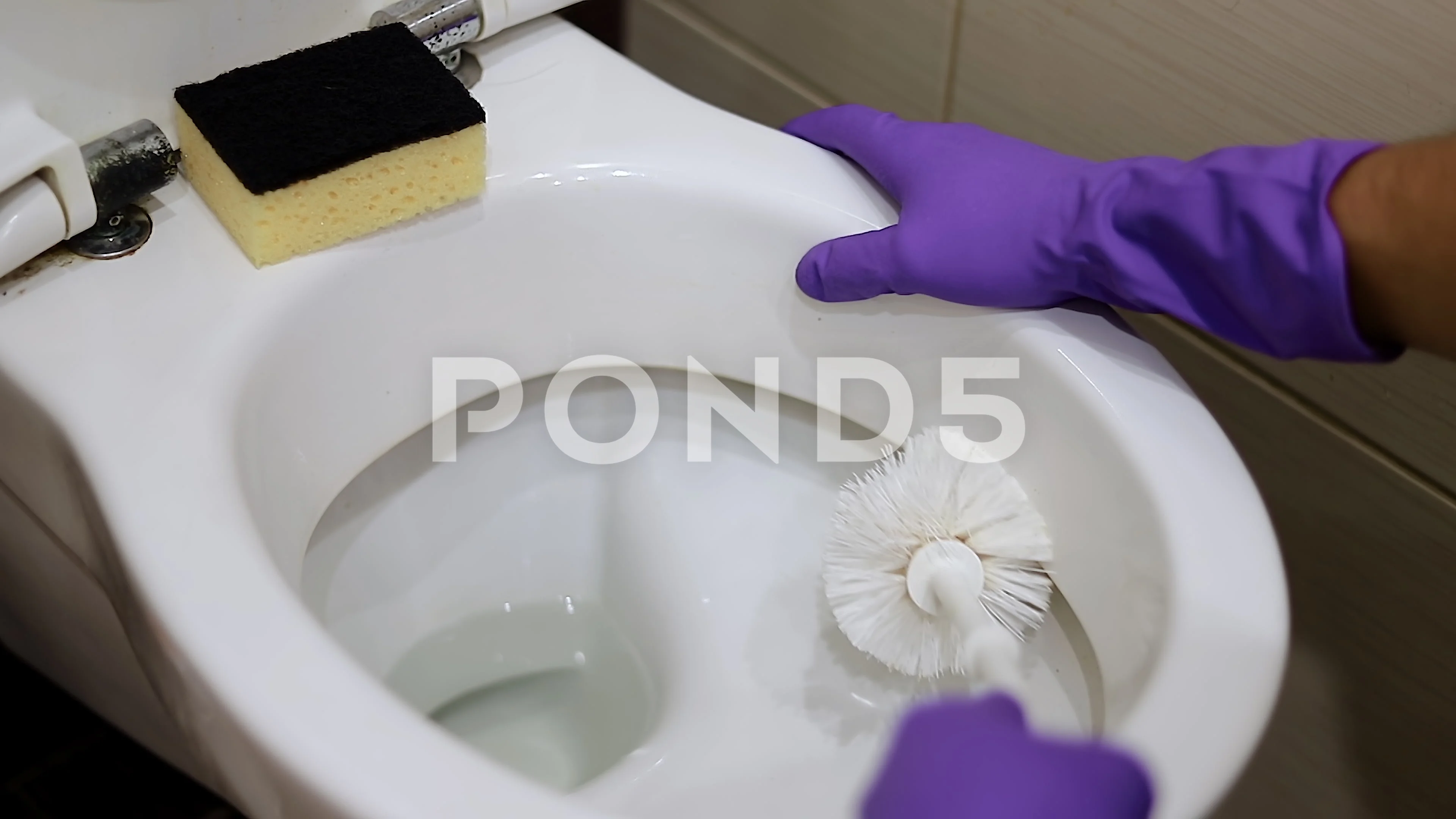 Man Cleaning The Bathroom