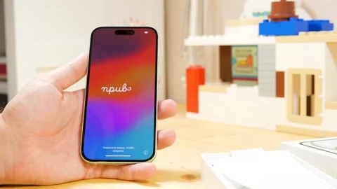 Man hand hold new iPhone. Hello text on ... | Stock Video | Pond5