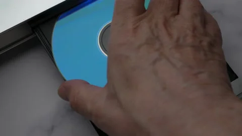 Man Of Hand Loading Disc Into The Device... | Stock Video | Pond5