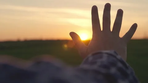 man hand shades towards the sunset, man ... | Stock Video | Pond5