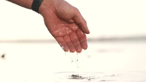 Man hand is touching water. Clean ocean.... | Stock Video | Pond5