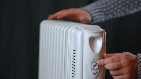 Man hand turn off button on thermostat o... | Stock Video | Pond5