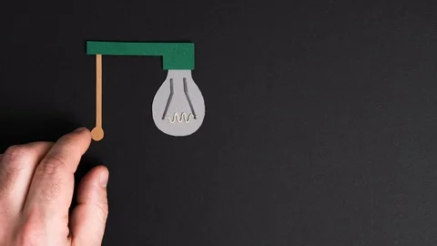 Man hand turns on incandescent light bul... | Stock Video | Pond5