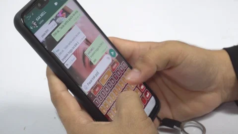 A man hand using WhatsApp on his Phone a... | Stock Video | Pond5