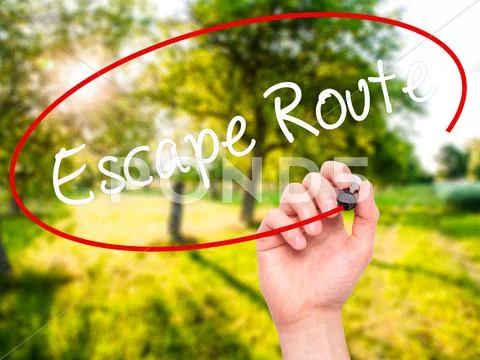 Man Hand writing Escape Route with black marker on visual screen ...