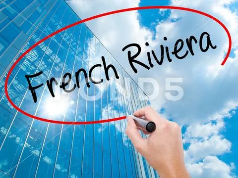 Man Hand writing French Riviera with black marker on visual screen ...