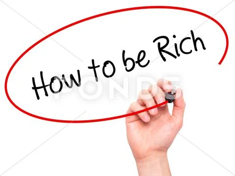 Photograph: Man Hand writing How to be Rich with black marker on visual ...