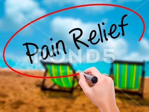 Man Hand writing Pain Relief with black marker on visual screen ...