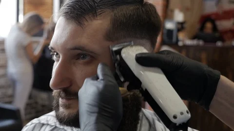 Man hands grooming man hair in barber sh... | Stock Video | Pond5