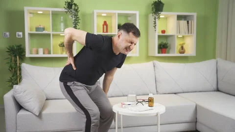 A man with a herniated disc, lifting hea... | Stock Video | Pond5