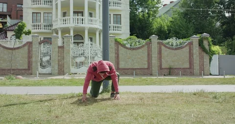 Man hits ground, stands up, hit head to ... | Stock Video | Pond5