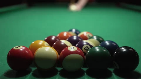 Man hits a pyramid pool balls with cue i... | Stock Video | Pond5