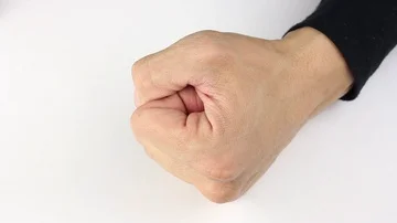 man hits the white table with his fist a... | Stock Video | Pond5