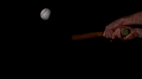 Man hitting baseball with bat on black b... | Stock Video | Pond5