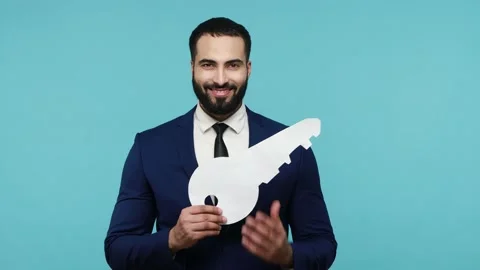 Man holding big key and looking at camer... | Stock Video | Pond5