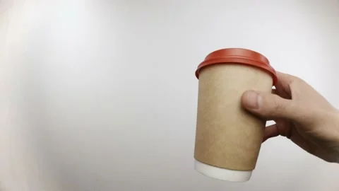 Man is holding coffee cup in his hand an... | Stock Video | Pond5