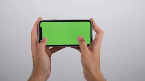 man holding green screen phone playing g... | Stock Video | Pond5