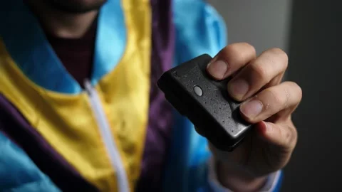 Man Holding His Pager Beeper Scrowling T... | Stock Video | Pond5