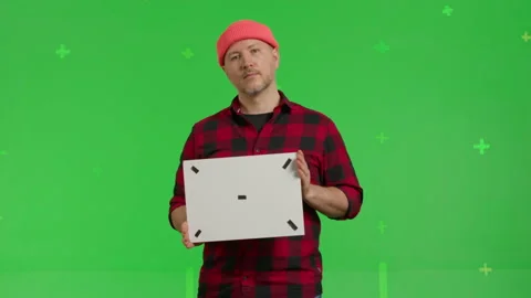 man holding a rectangular poster with ma... | Stock Video | Pond5