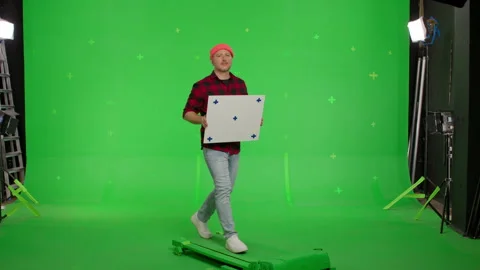 man holding a rectangular poster with ma... | Stock Video | Pond5