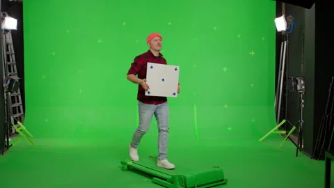 man holding a rectangular poster with ma... | Stock Video | Pond5