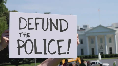 Man Holds Defund the Police Protest Sign... | Stock Video | Pond5