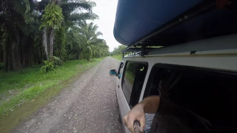 Man Holds Selfie Stick Out the Window of... | Stock Video | Pond5