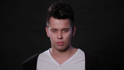 A Man Immitating Headache Against a Blac... | Stock Video | Pond5