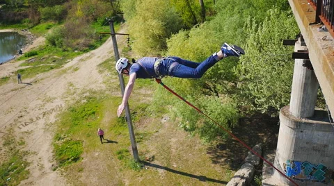 a man jumping from the bridge facing for... | Stock Video | Pond5