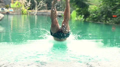 Man jumping into swimming pool | Stock Video | Pond5