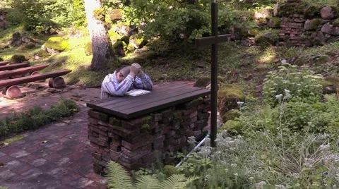 Man kneeling at the altar | Stock Video | Pond5