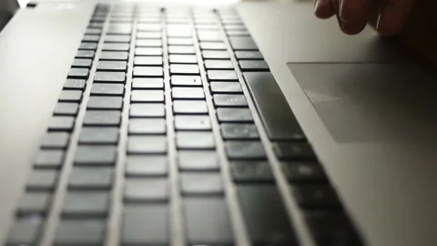 Man at the laptop is typing over a keybo... | Stock Video | Pond5