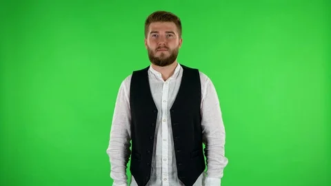 Man laughs while looking at camera. Gree... | Stock Video | Pond5