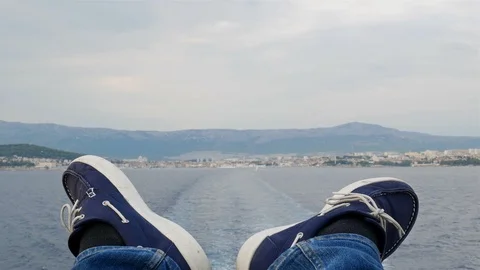 Man legs on cruise boat rear end with ci... | Stock Video | Pond5