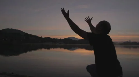 Man Lifting Arms In Prayer and Praise A... | Stock Video | Pond5