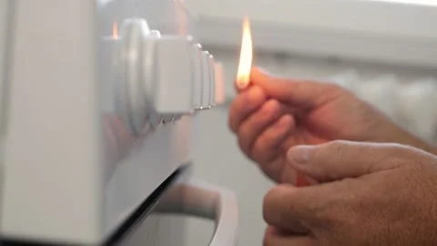 A Man Lighting Up Fire at Gas Cooker Usi... | Stock Video | Pond5