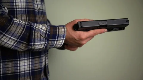 Man loading a handgun. concealed carry a... | Stock Video | Pond5