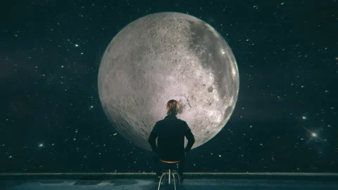 Man Looking Full Moon Sitting On Buildin... | Stock Video | Pond5