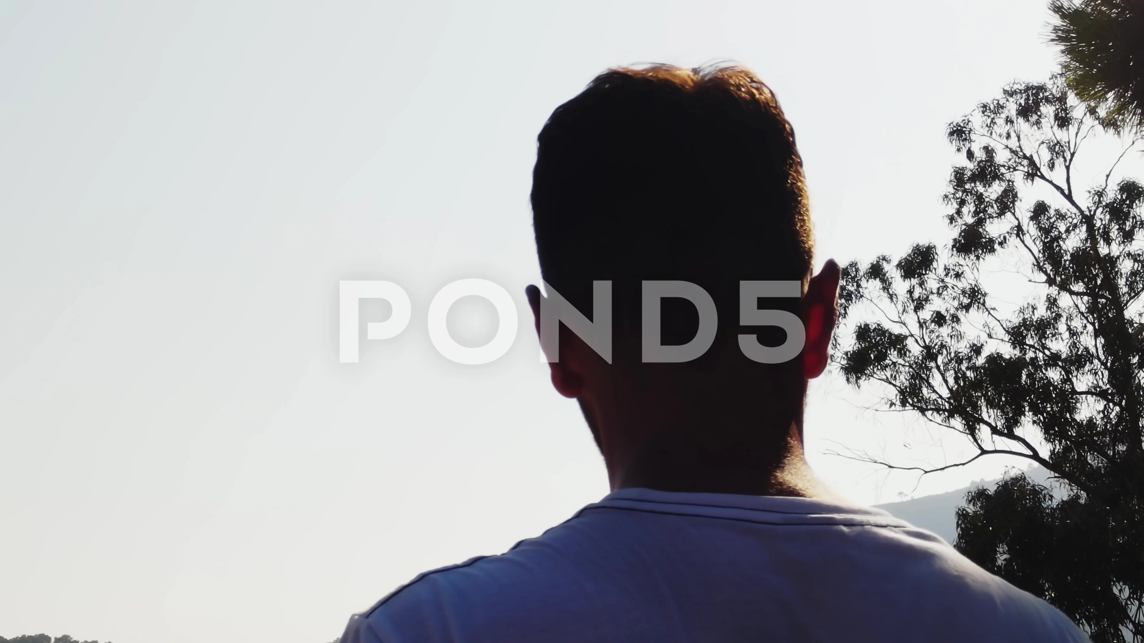 Silhouette Man Looking Over Shoulder