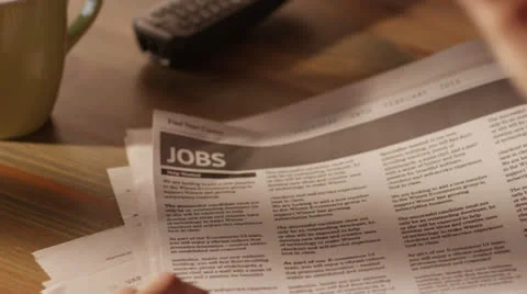 Man Looking for Job in a Newspaper and M... | Stock Video | Pond5