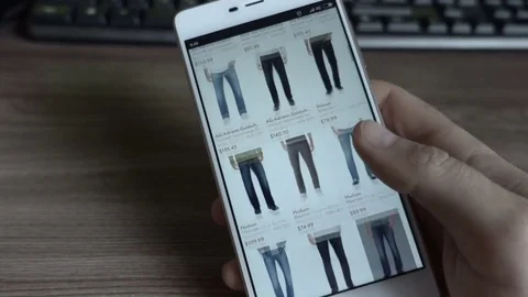 A man looks at the goods in the online c... | Stock Video | Pond5