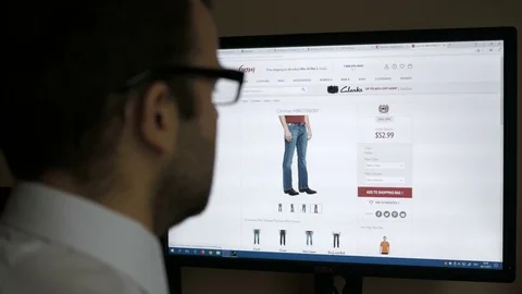A man looks at the goods in the online c... | Stock Video | Pond5