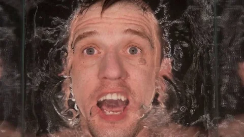 the man lowered his head into the water ... | Stock Video | Pond5